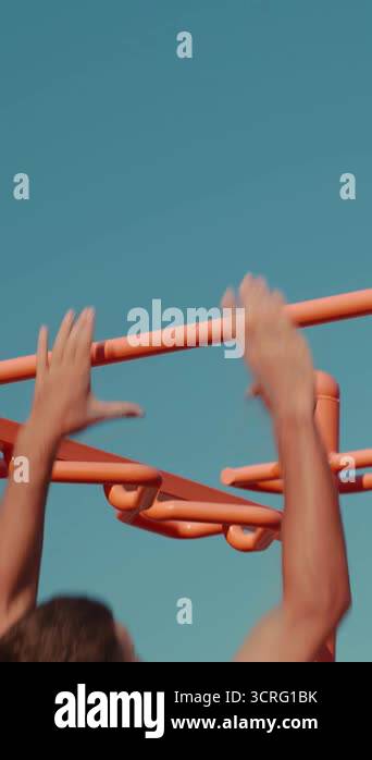 Strong man exercising on uneven bars. Athletic man doing pull-ups on ...