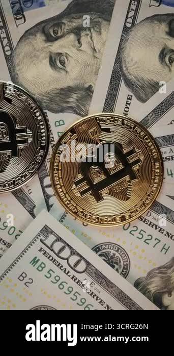 Bitcoins falling on dollar bill background. Blockchain cryptocurrency ...