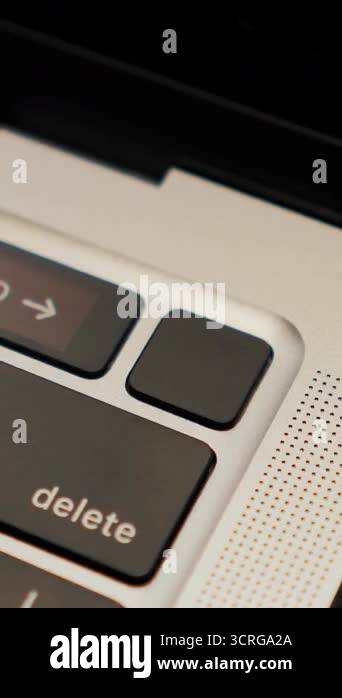 Man unlocking laptop computer with touch ID, close up of finger and ...