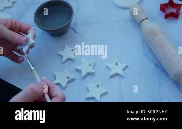 Christmas star Creator is using white air dry clay for making decor to ...