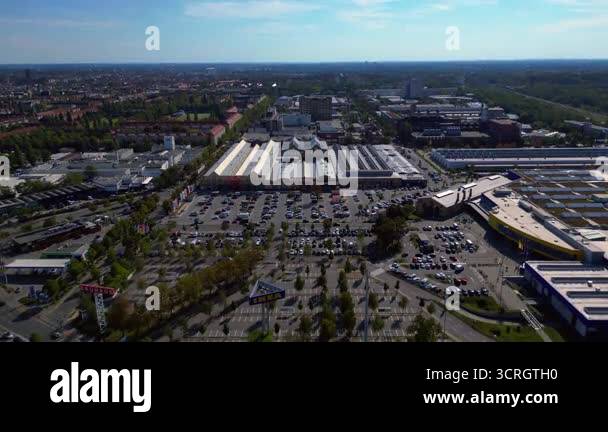 Aerial view of Berlin hardware store with parking lot and city ...