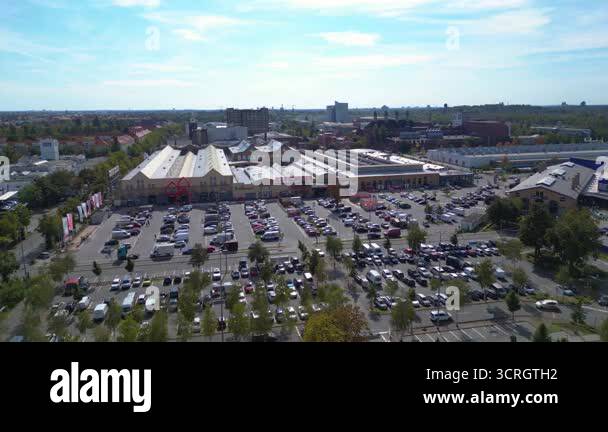 Aerial view of Berlin hardware store with parking lot and city ...