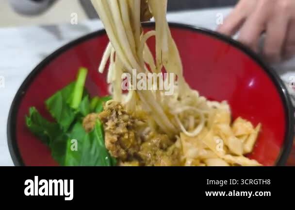 A delicious bowl of Mie Ayam, a classic Indonesian chicken noodle dish ...