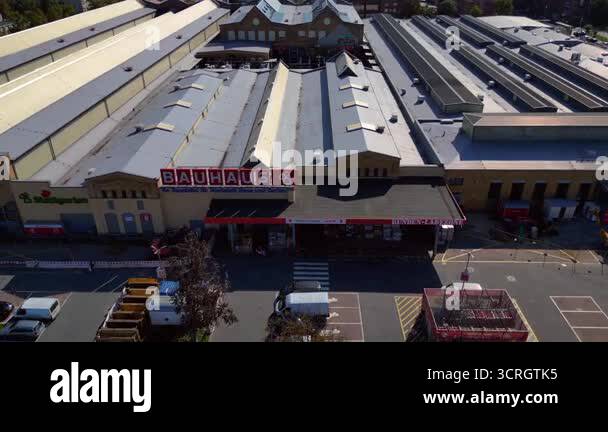 Aerial view of Berlin hardware store with parking lot and city ...
