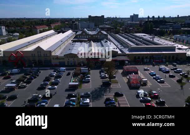 Aerial view of Berlin hardware store with parking lot and city ...