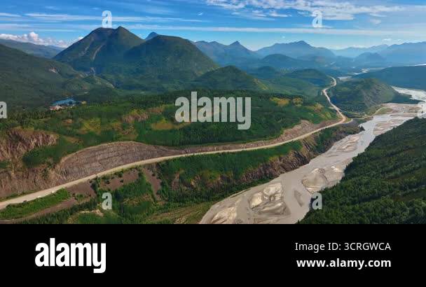 Green valleys and mountain ridges in Alaska. Aerial view of lush ...