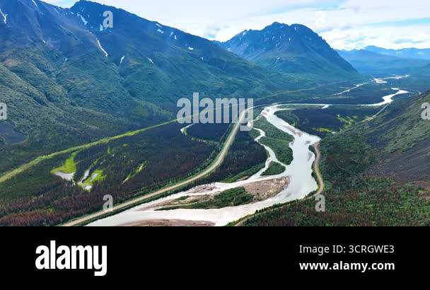 River delta with winding streams in Alaska mountains. Aerial view of a ...
