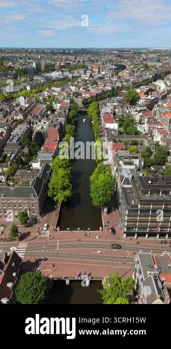 Breathtaking aerial footage captures a beautiful canal in a charming ...