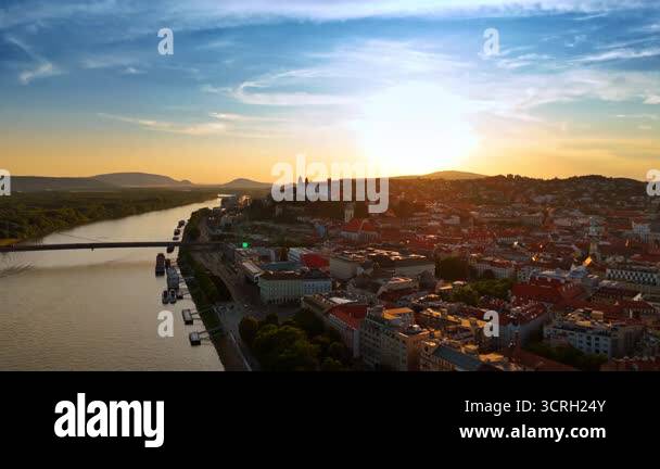 Golden hour over the old town of Bratislava, Slovakia. Drone footage ...