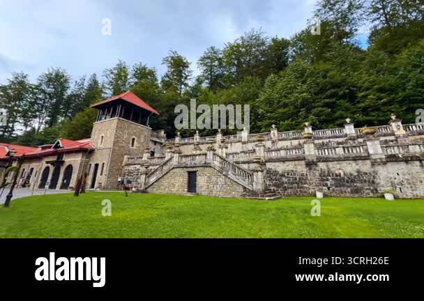 Lush greenery growing around the walls of the Cantacuzino Castle in ...