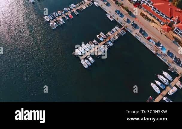 Aerial view of marina with yachts and coastline city. Top view of ...