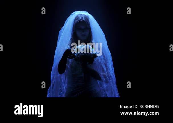 A creepy Halloween scene featuring a dead bride figure in a wedding ...