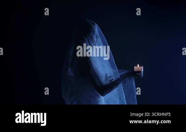 A spooky Halloween scene featuring a dead bride figure covered in a ...