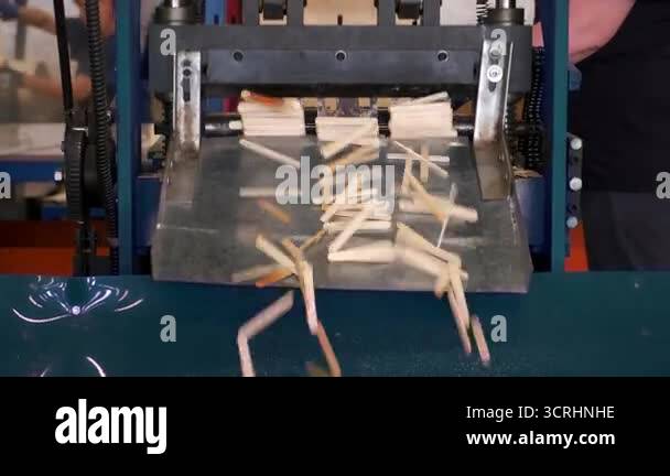 Factory automated machine separating wooden ice cream sticks on ...