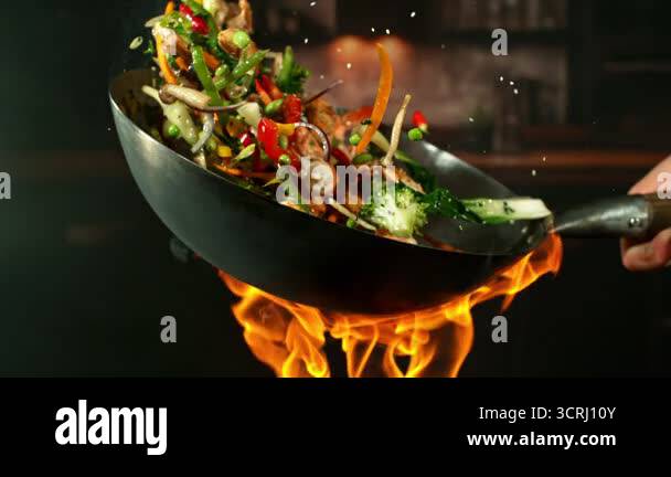 Super Slow Motion of Flying Asian Meal with Meat and Vegetable. Filmed on High Speed Cinema ...