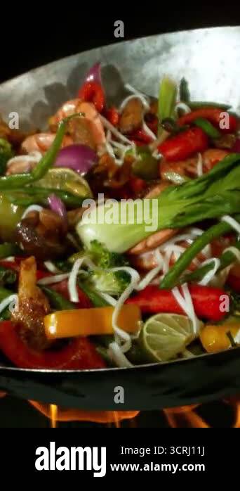Super Slow Motion of Flying Asian Meal with Vegetable and Meat.Filmed ...