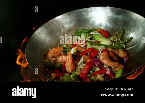 Super Slow Motion of Flying Asian Meal with Vegetable and Meat.Filmed ...