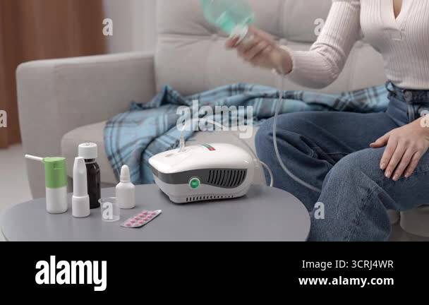 Close-up of sick woman with an inhaler. Unhealthy girl presses the ...