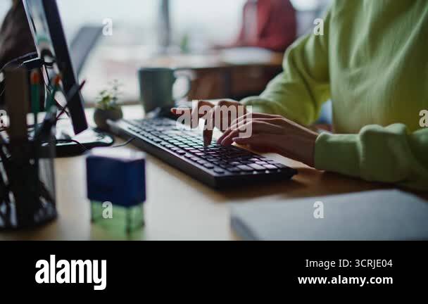 Online manager hands typing keyboard making report at corporate office closeup. Young business ...