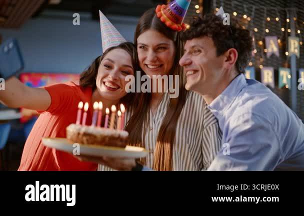 People holding birthday cake making selfie together closeup. Business ...