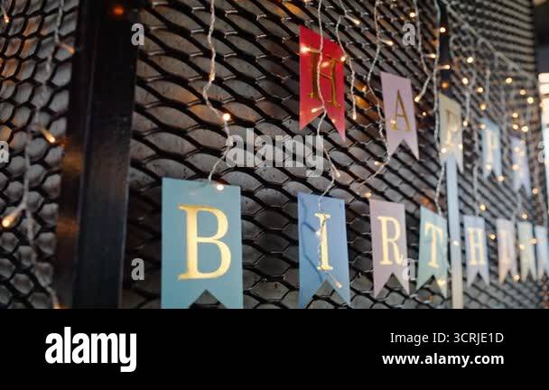 Bright festive banners hanging on decorated office wall closeup ...