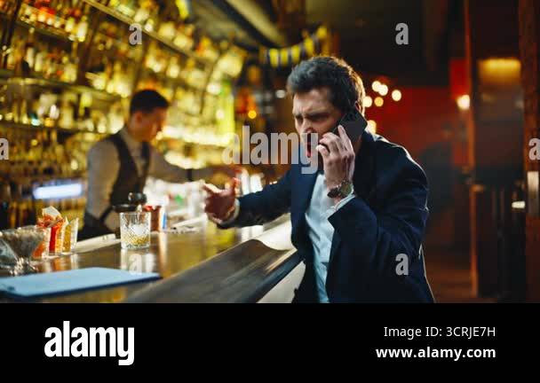 Emotional man yelling smartphone call at night bar closeup. Nervous ...