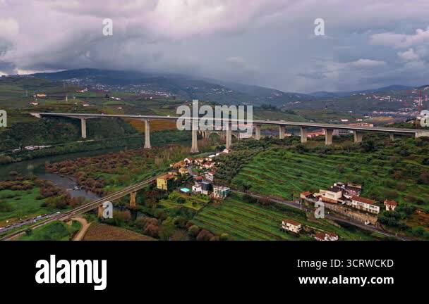 Bridge structure crossing cultivated slopes in scenic countryside ...