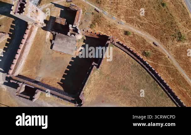 Ancient castle standing on dry hill aerial view. Strong fortress wall ...