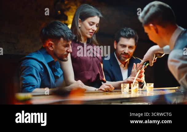 Closeup people waiting cocktails resting in night club party. Relaxed ...