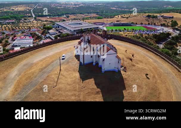 Medieval fortification enclosing church raising on settlement. Stone ...