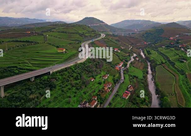Stunning countryside greenery aerial view. Curve asphalt road running ...