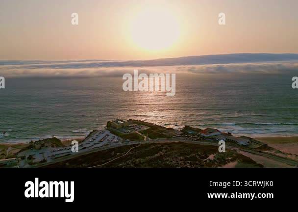 Bright sun rising on sky over picturesque ocean landscape drone view ...