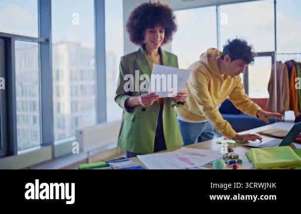 Team tailors creating fashion collection in design studio office ...