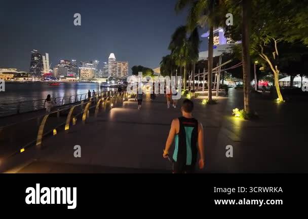 Marina Sand, Singapore - Jul 17 2024: A group of people walking on a ...
