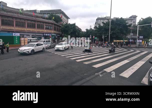 Chengdu, China-11 October, 2024: Wide shot of a busy crosswalk with ...