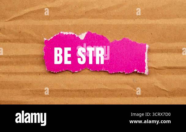 Be Strong message written on ripped torn paper background. Conceptual ...