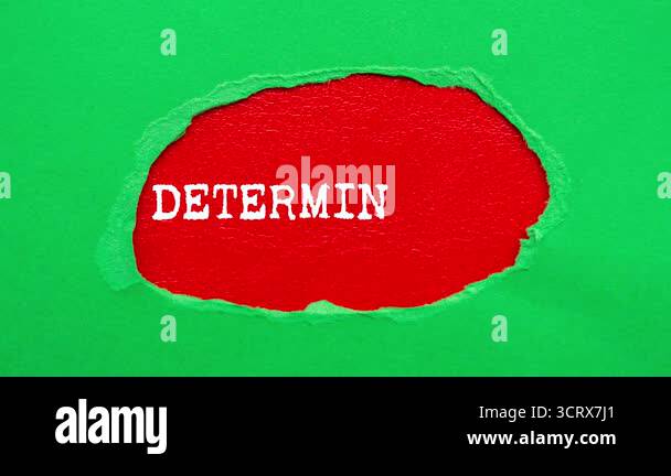Determination message written on ripped torn paper background ...