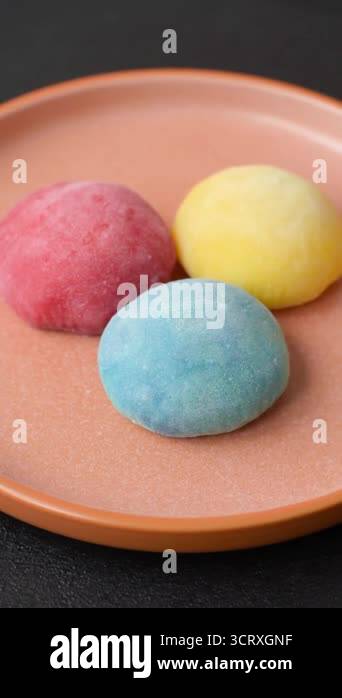 Japanese mochi, ice cream or Asian sweets made from rice flour with fruit filling. Mochi of ...
