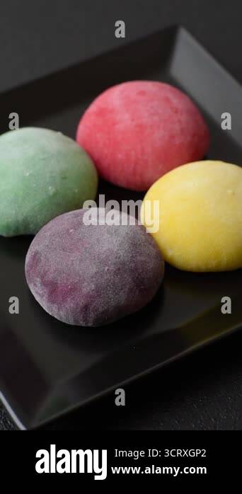 Japanese mochi, ice cream or Asian sweets made from rice flour with fruit filling. Mochi of ...