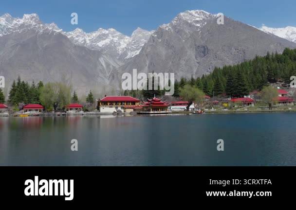 Scenic View of Traditional Buildings by a Lake in the Mountains of ...