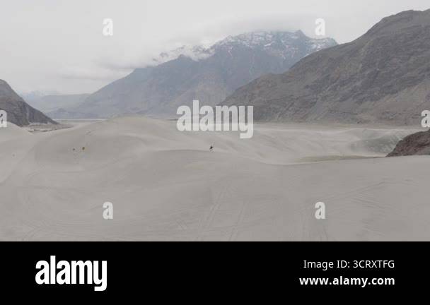 Aerial View of Snow-Capped Mountains and Sand Dunes in Northern ...