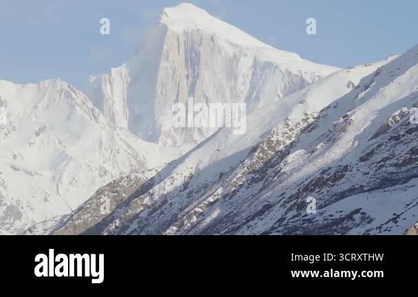 A breathtaking view of a snow-capped mountain in the Karakoram Range ...
