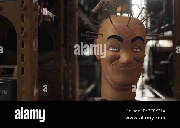 Geniol Head with Nails and Screws in Antique Store: Headache Metaphor ...