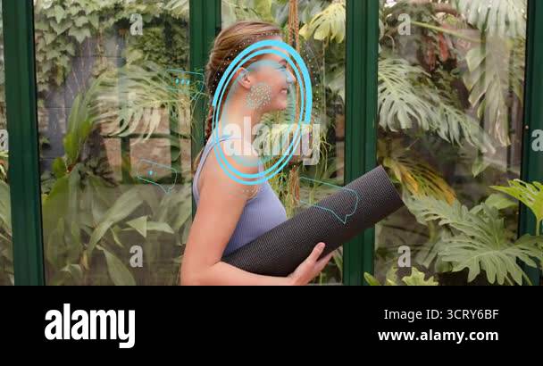 Female entering conservatory carrying yoga mat activating fitness ...