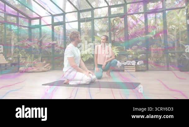 instructor leaning forward and speaking animating arrows on participant on mat guiding yoga pose ...