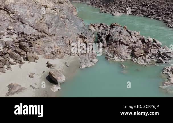 Aerial View of a River Flanked by Unique Rock Formations in Pakistan ...