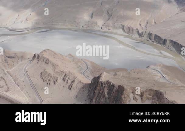 Aerial view of a winding road through a desert landscape in Pakistan ...