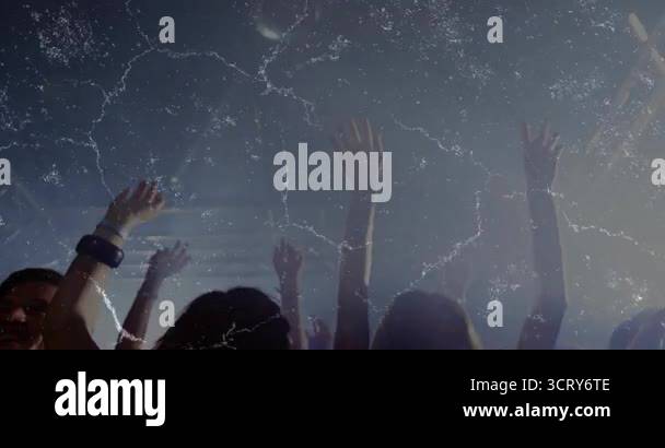 Starting with front crowd lifting arms to beat, hands rising and ...