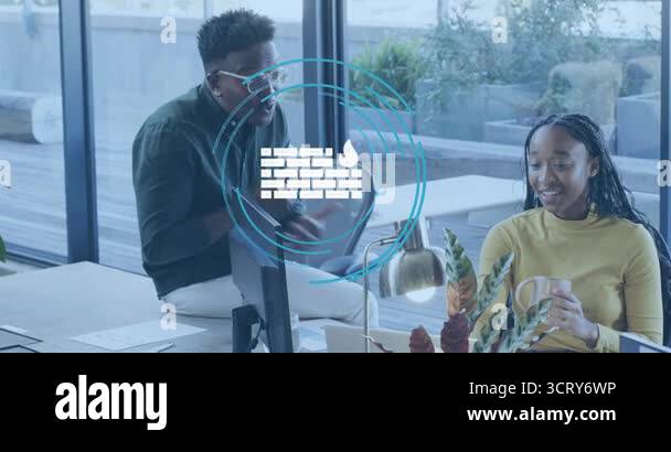 Colleagues pointing at monitor and activating graphic around firewall ...