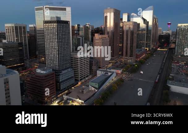 Aerial view of skyscrapers at night in Calgary, Alberta's booming ...
